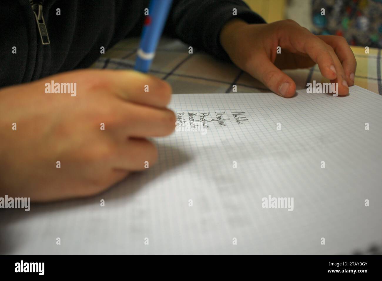 young kid working and writing at home after school Stock Photo - Alamy