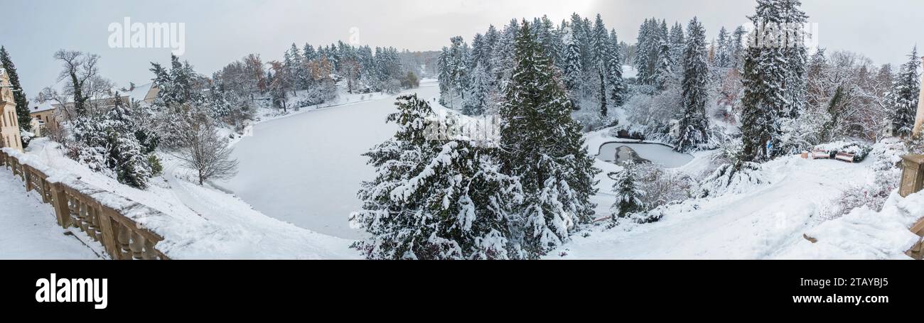 The winter snowy scenery of Pruhonice Castle and the Podzamecky pond in ...
