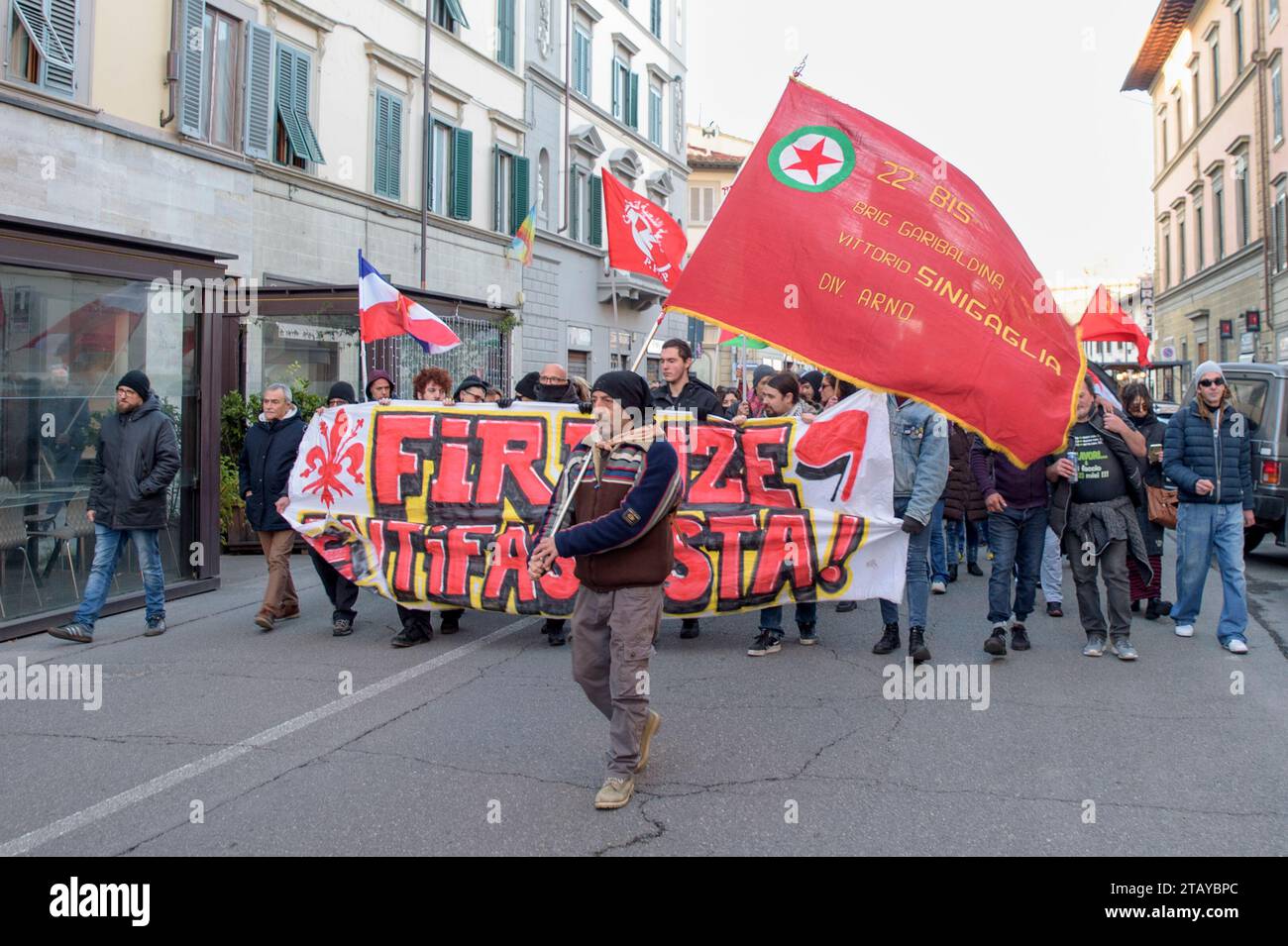 Florence, Italy. 3rd Dec, 2023. A protester carries the flag of the ...