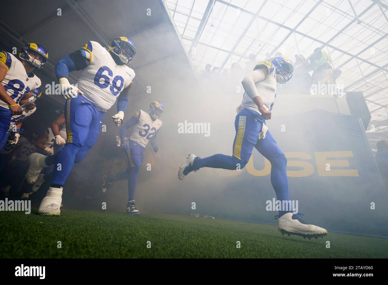 Los Angeles Rams quarterback Matthew Stafford, right, runs out of the ...