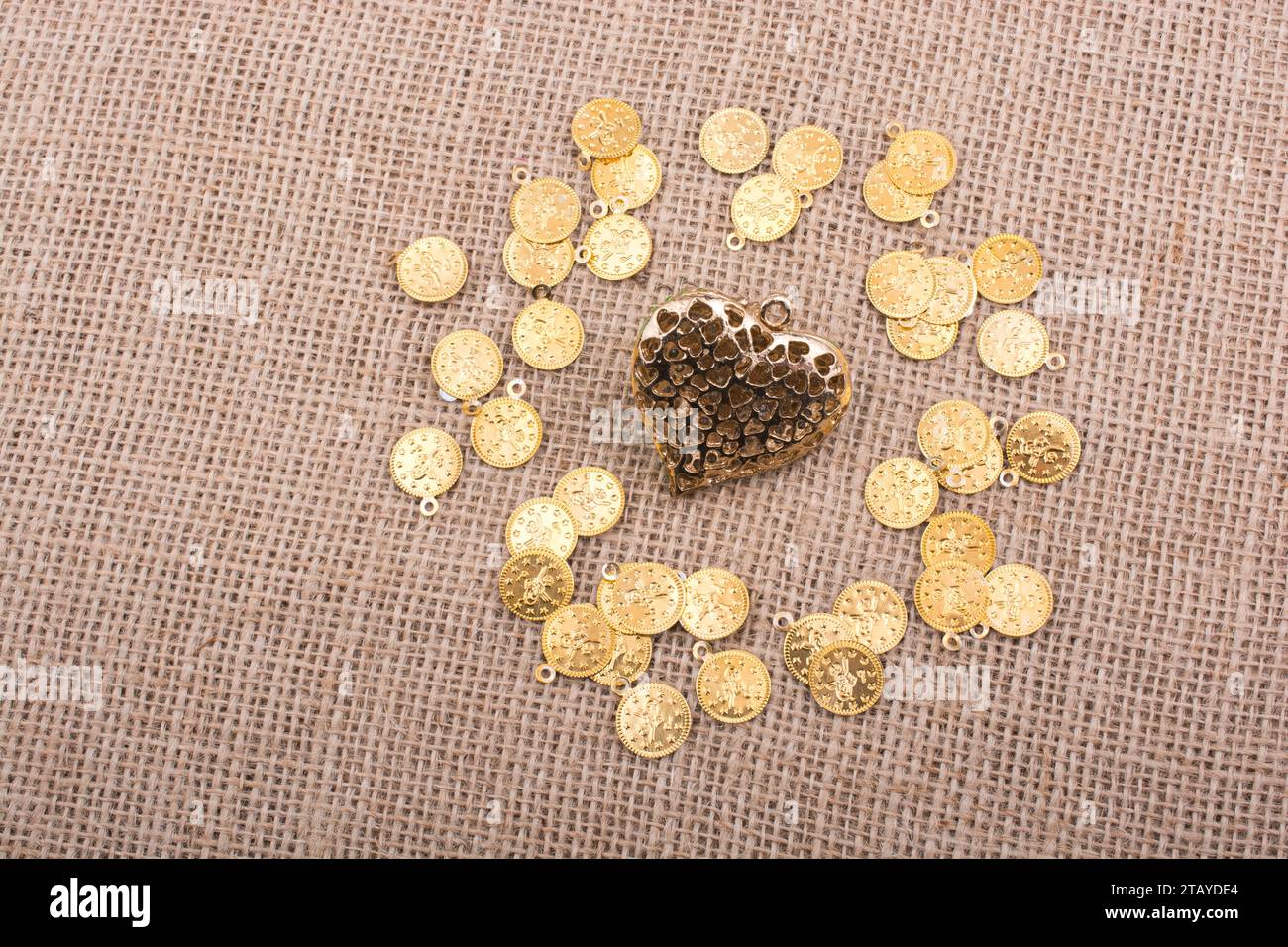 Hand holding heart coins hi-res stock photography and images - Alamy