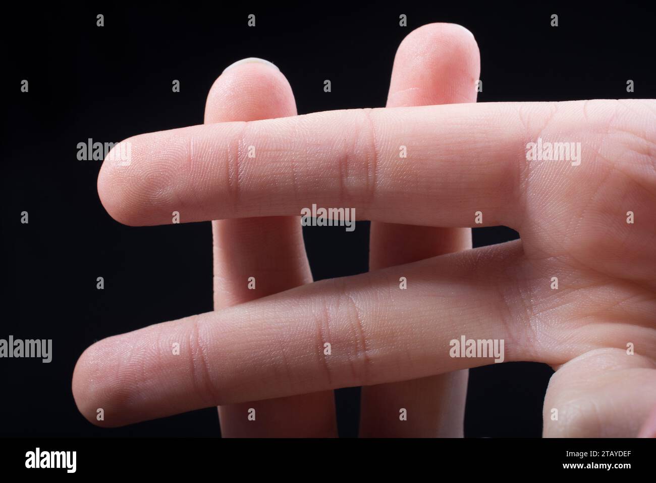 Fingers forming a hashtag symbol isolated on black background Stock ...