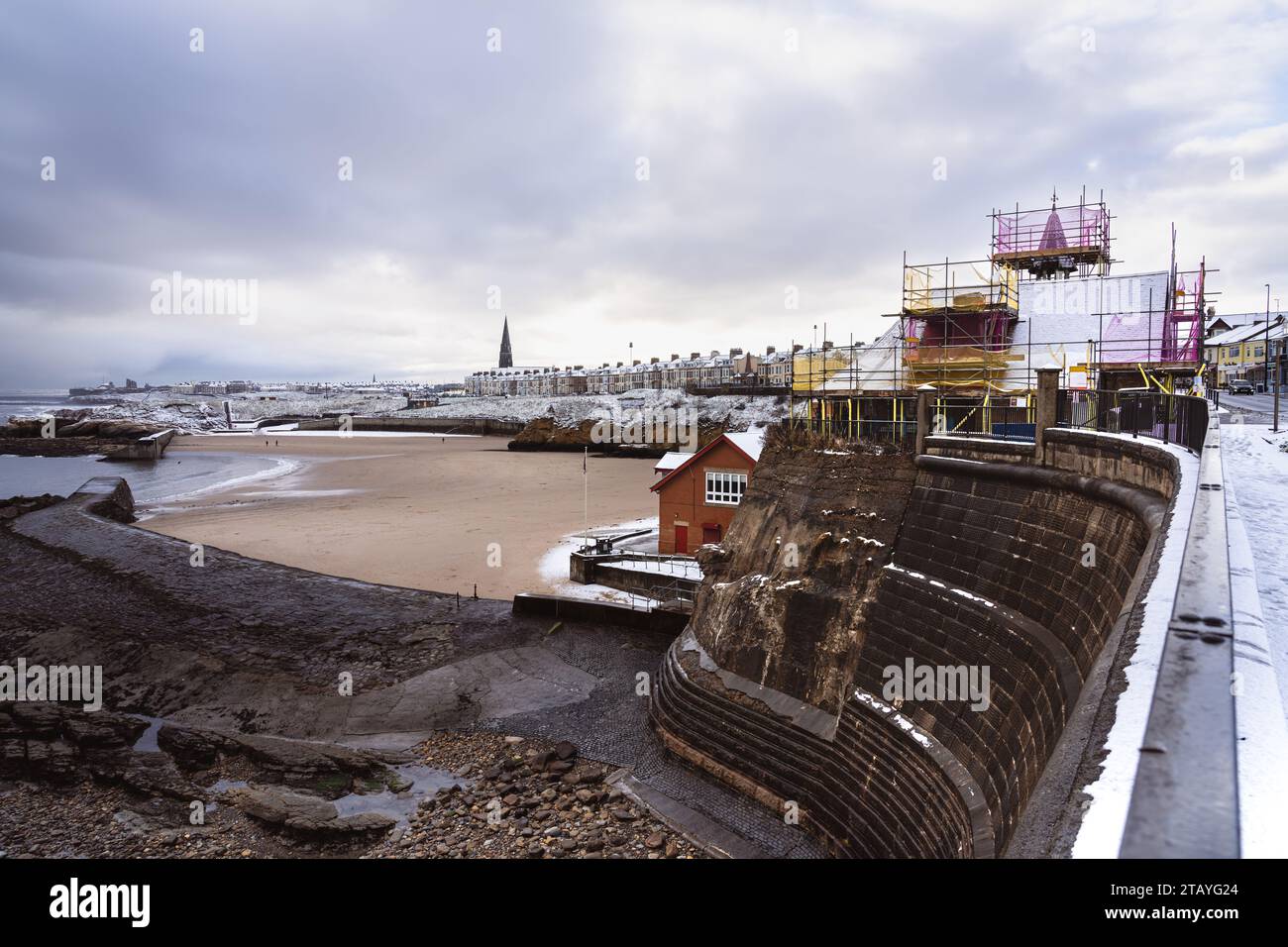 Cullercoats Bay with some snow on the beach and views of the RNLI and ...