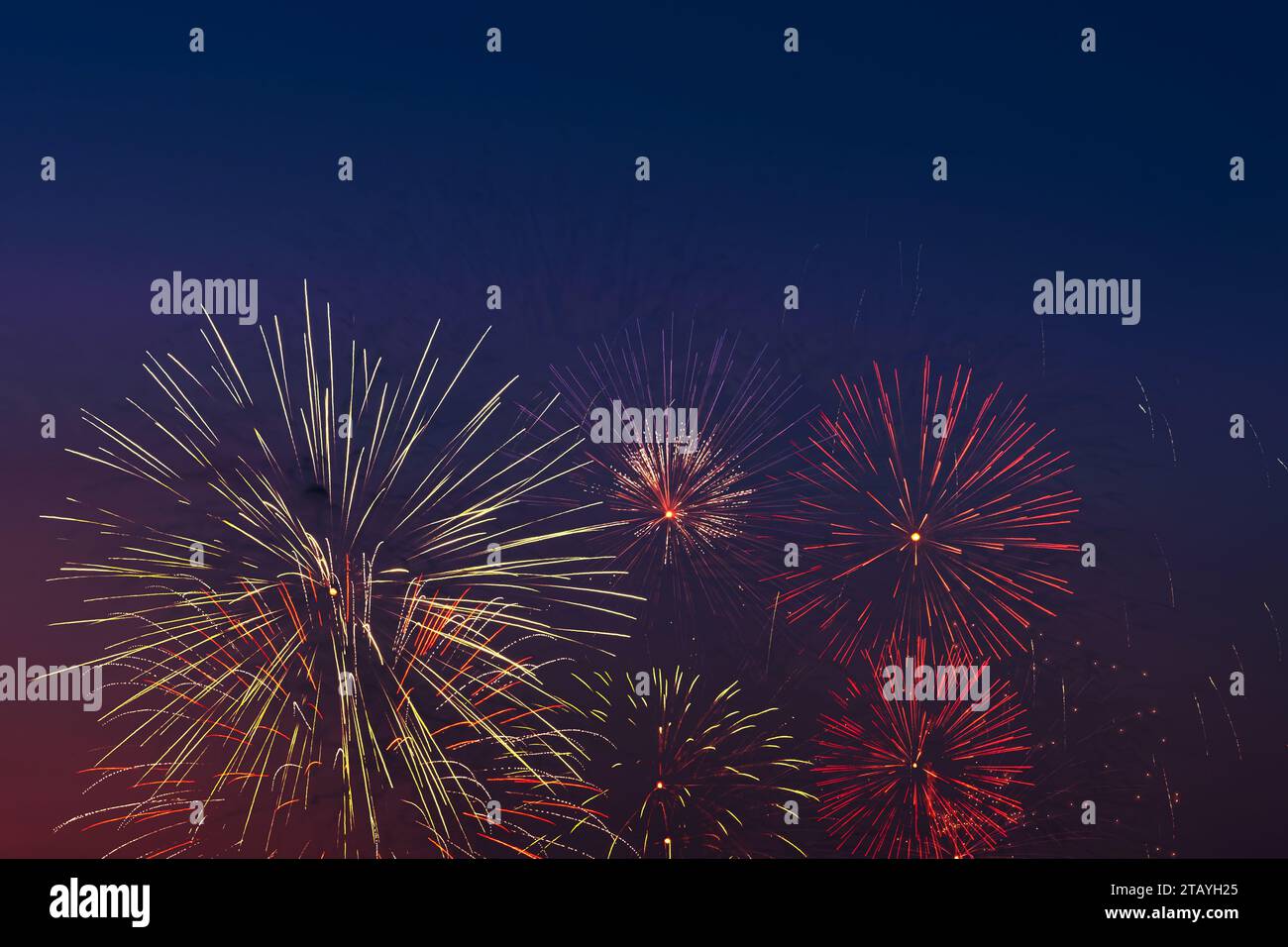 Colorful fireworks on night sky background. Celebration and holidays ...