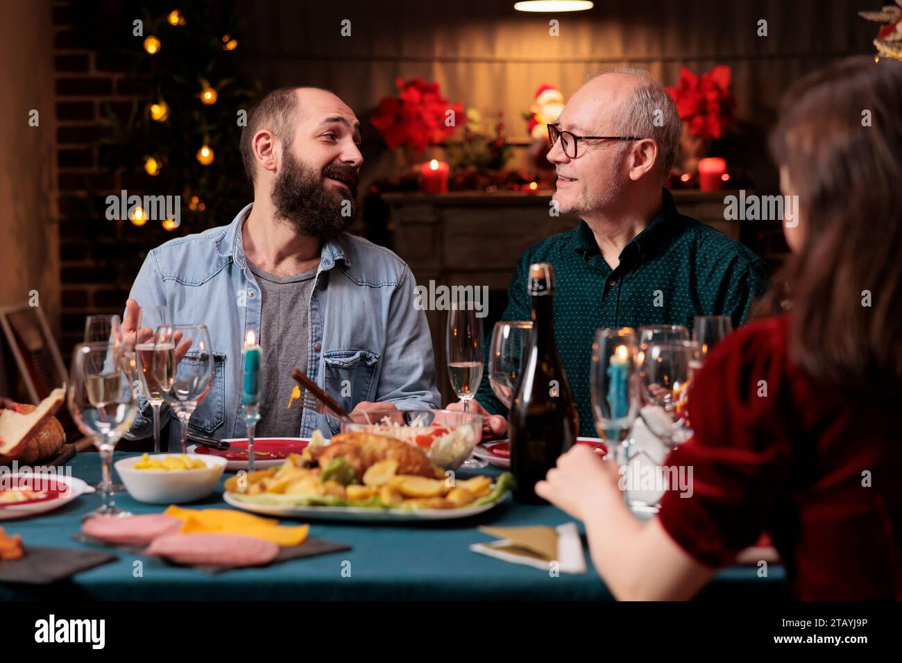 Group of people meeting on christmas to celebrate festive dinner ...