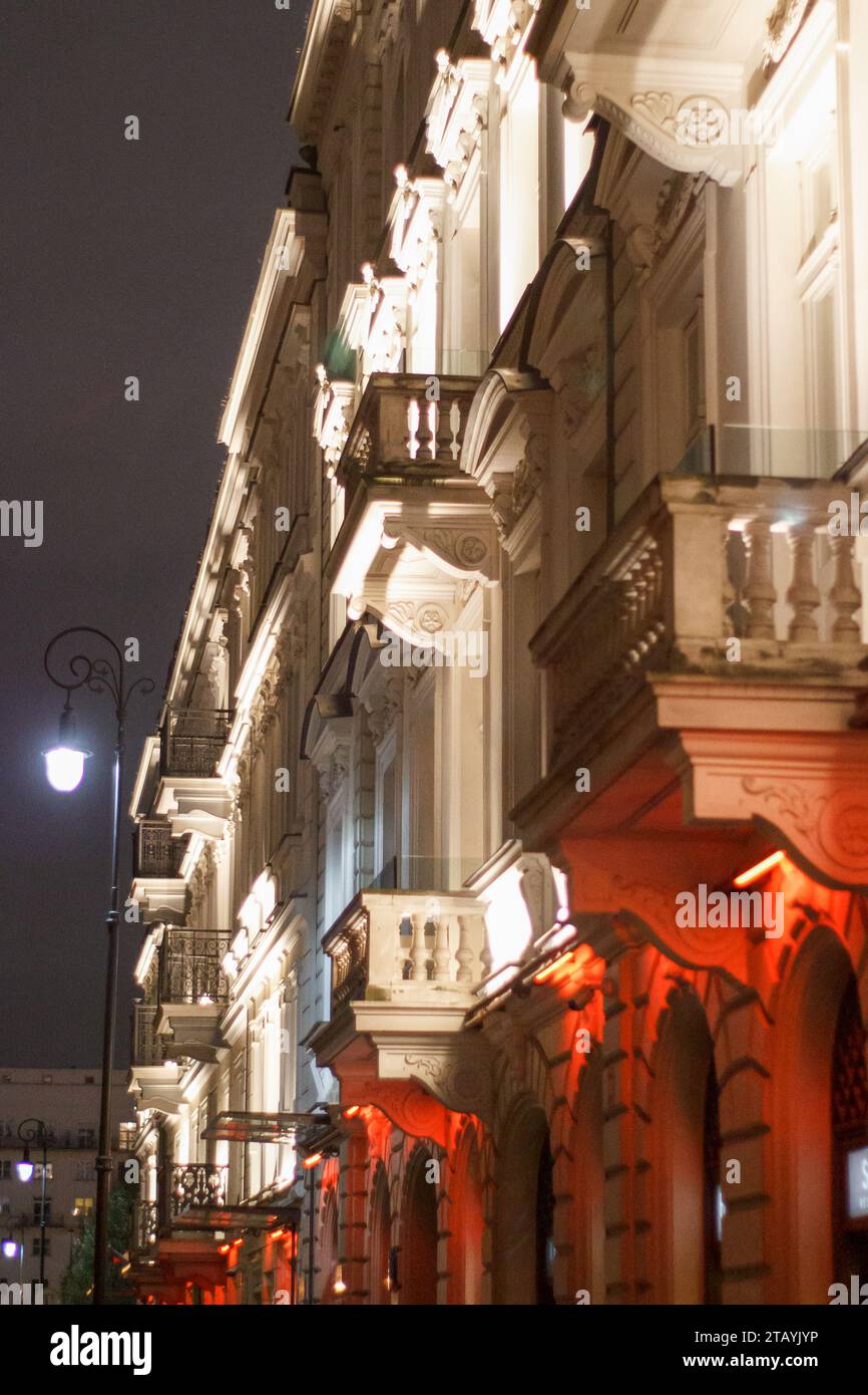 XIX century building in Warsaw, Poland, lighted with white and red ...