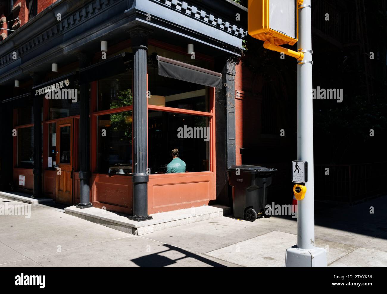Solitary man sitting at a New York City restaurant window Stock Photo ...
