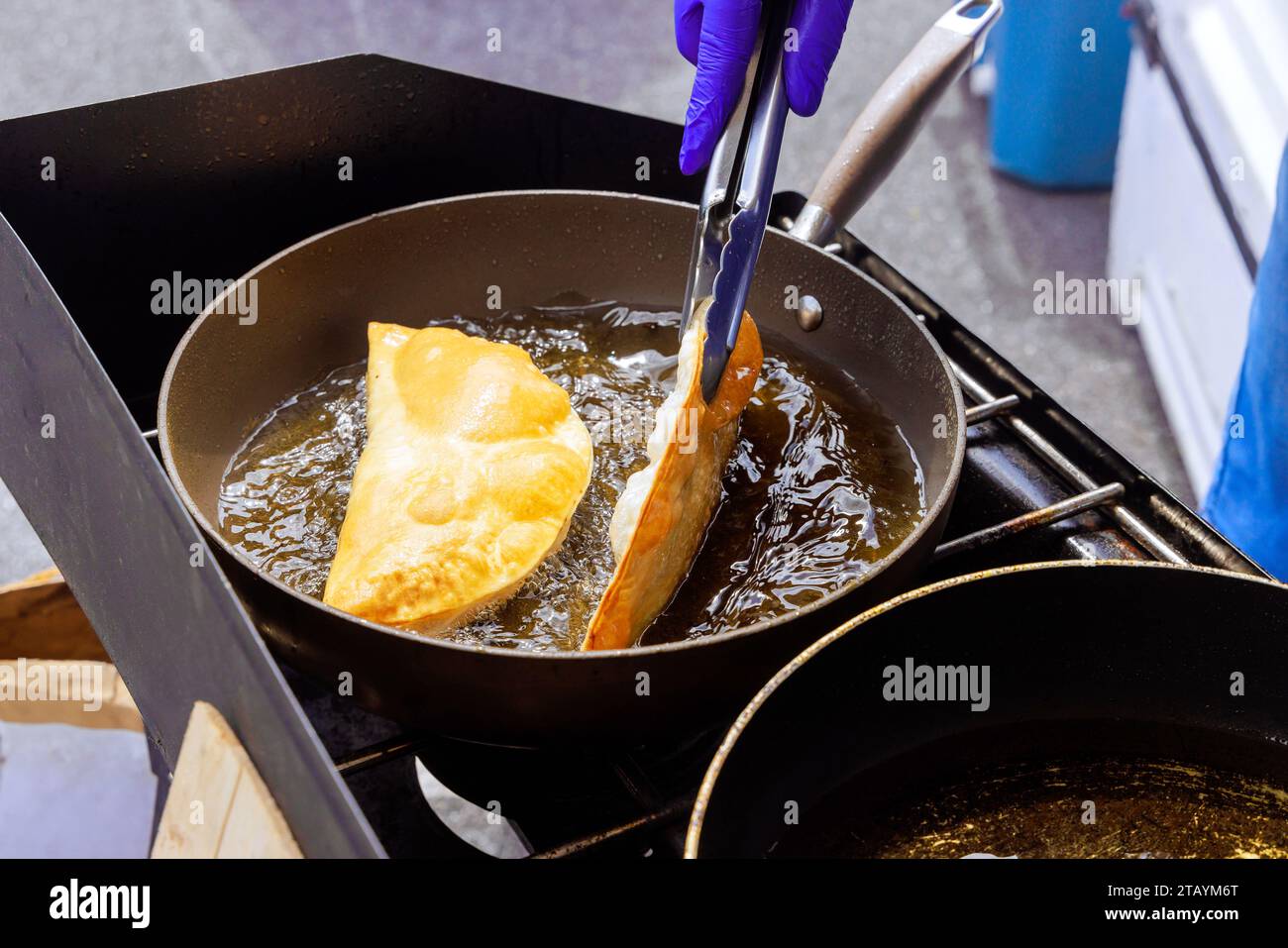 Fried cheburek with oil, traditional Crimean Tatar food dish Stock ...