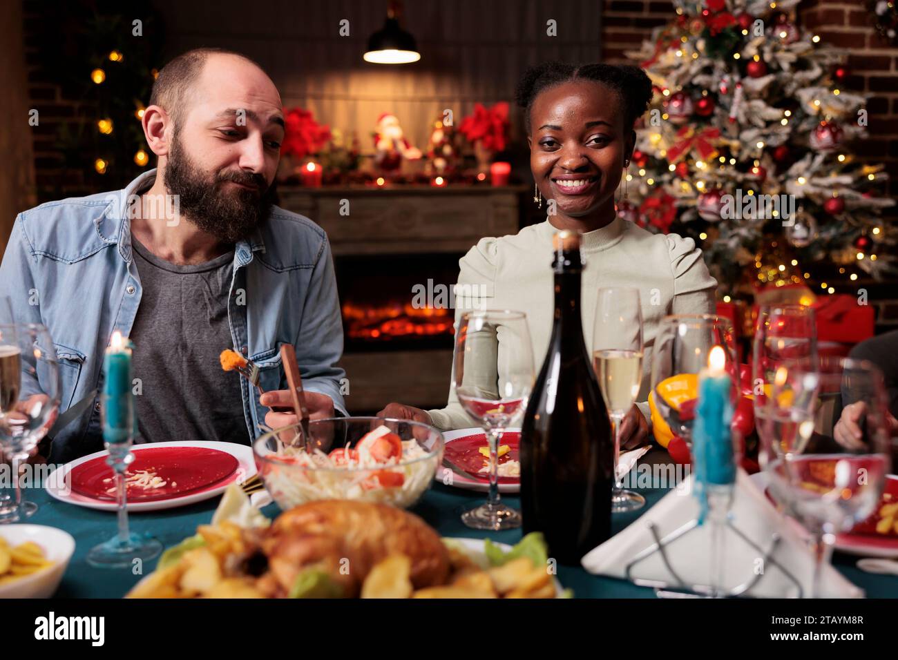 African american woman at festive dinner celebrating december holiday ...