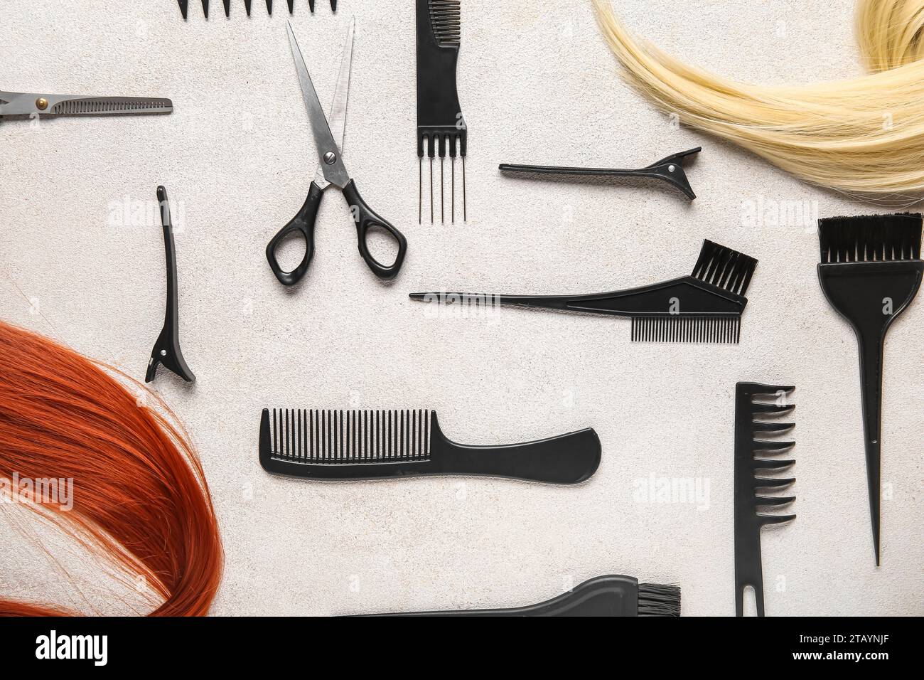 Different hair with set of hairdresser's tools on grey background Stock ...