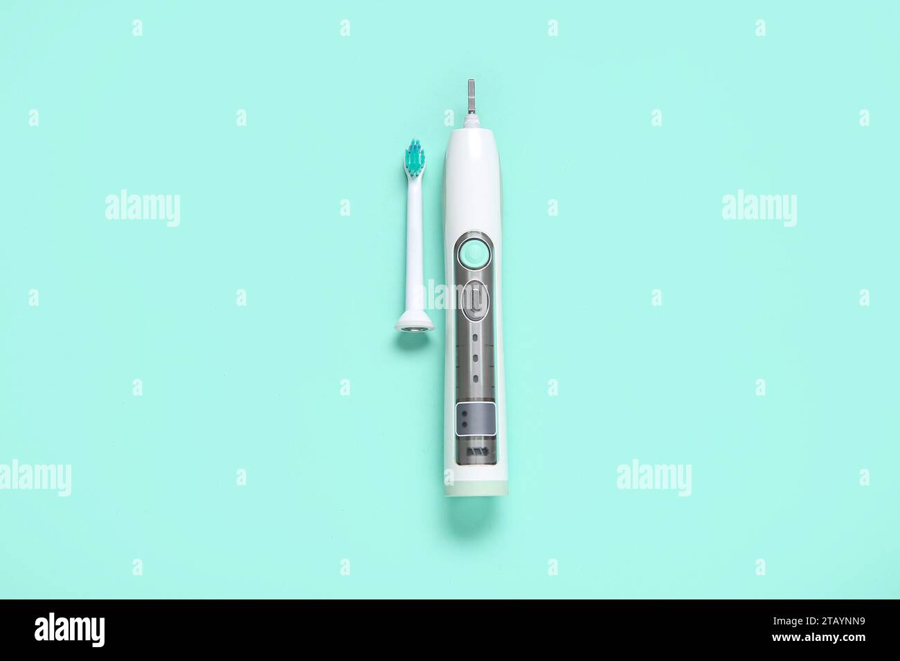 Electric toothbrush on color background Stock Photo - Alamy