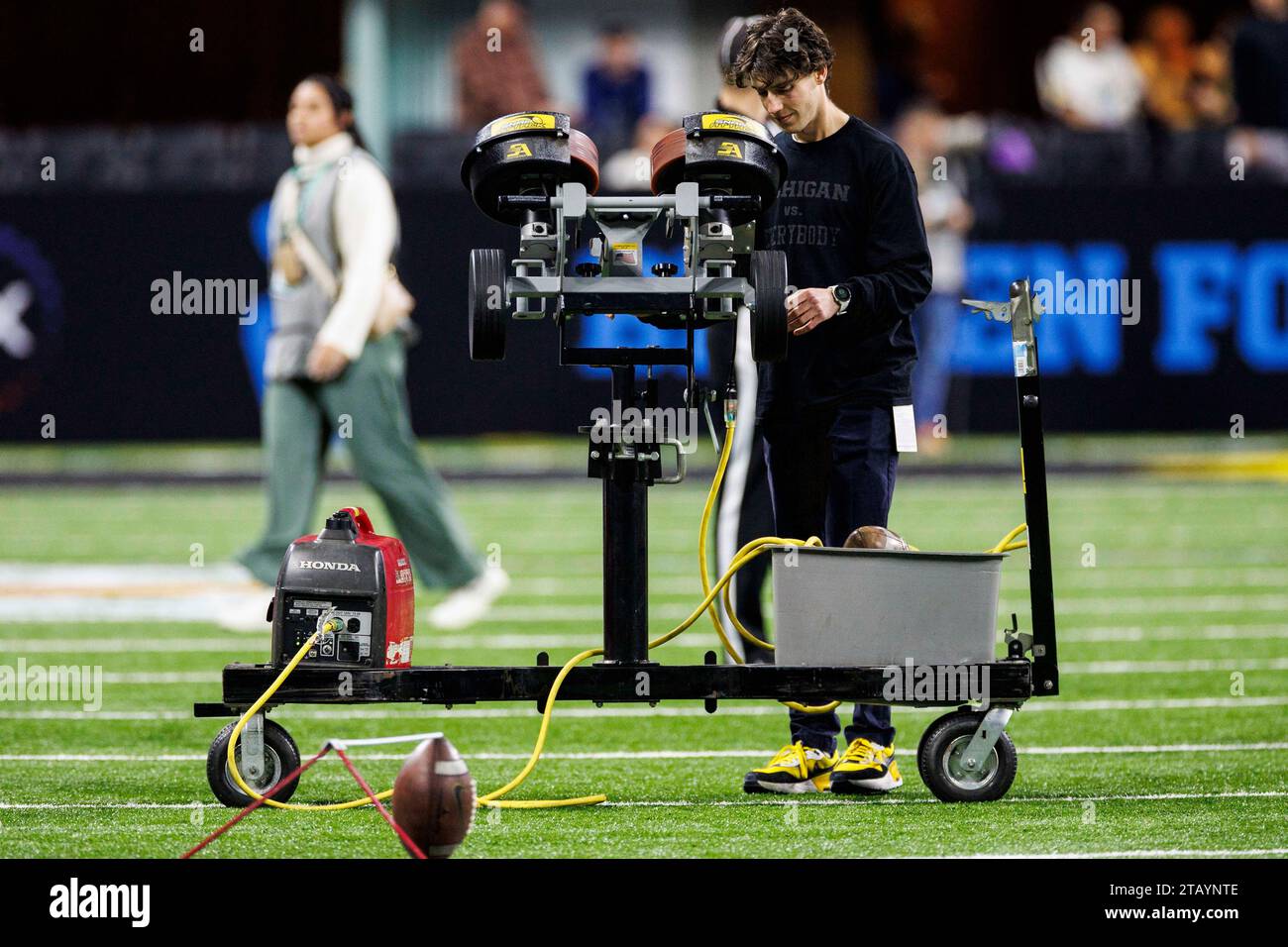 Indianapolis, Indiana, USA. 02nd Dec, 2023. Michigan staffer prepares ...