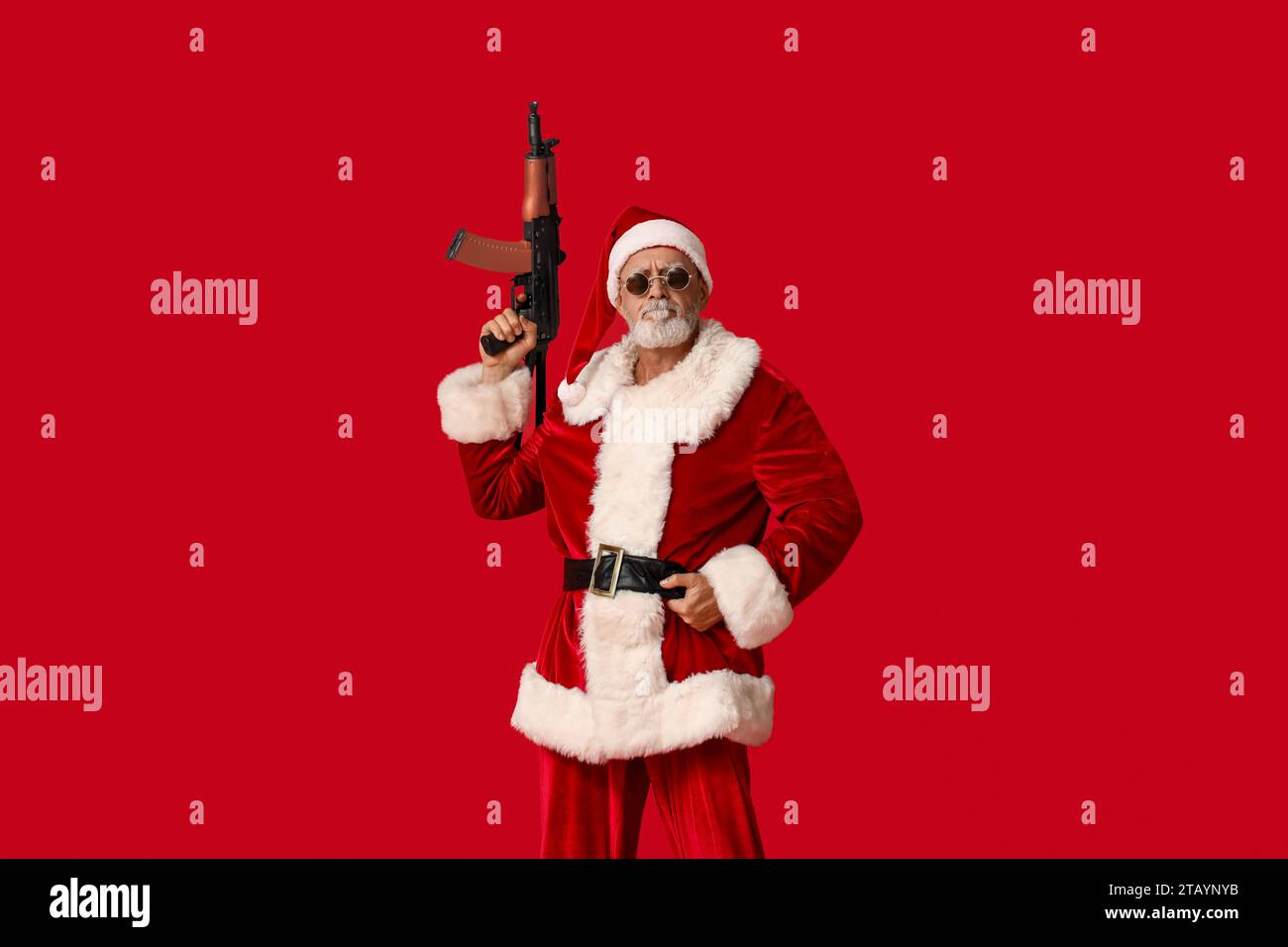 Santa Claus in sunglasses with assault rifle on red background Stock ...
