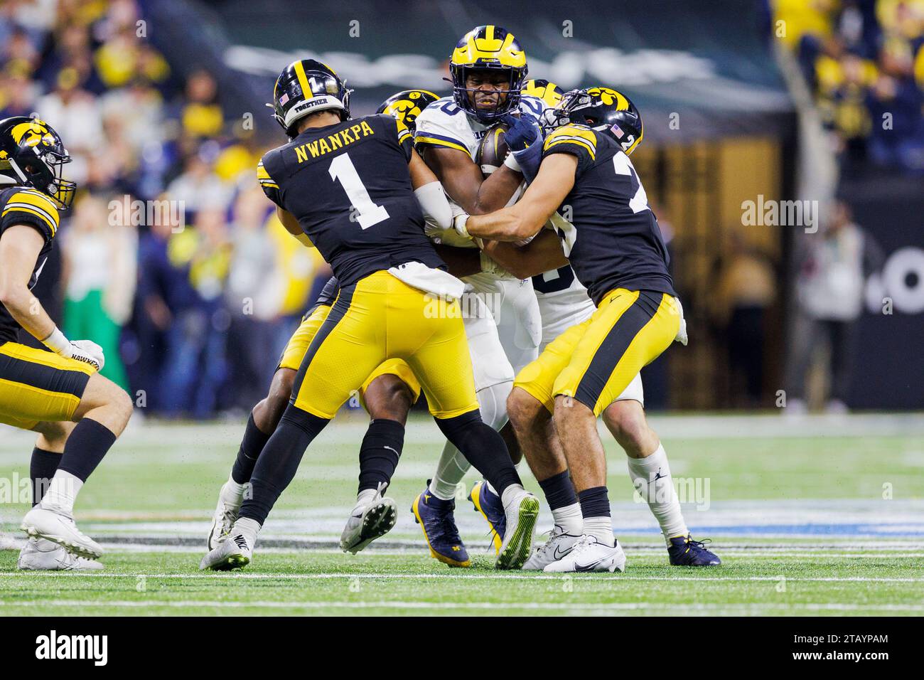 Indianapolis, Indiana, USA. 02nd Dec, 2023. Michigan running back Kalel Mullings (20) runs with ...