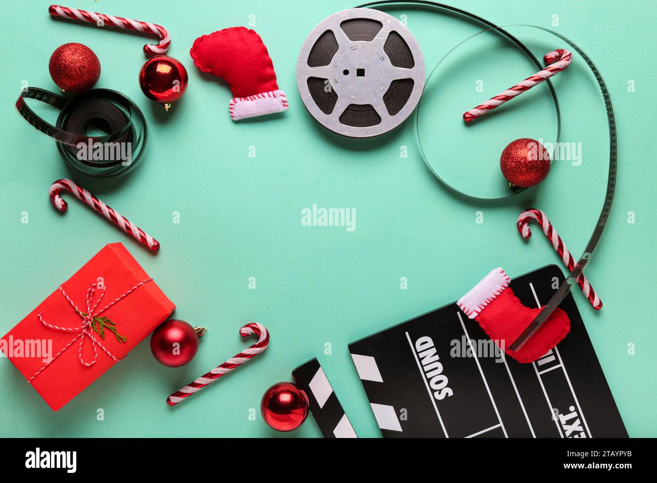 Frame made of film reels with movie clapper and Christmas decor on ...
