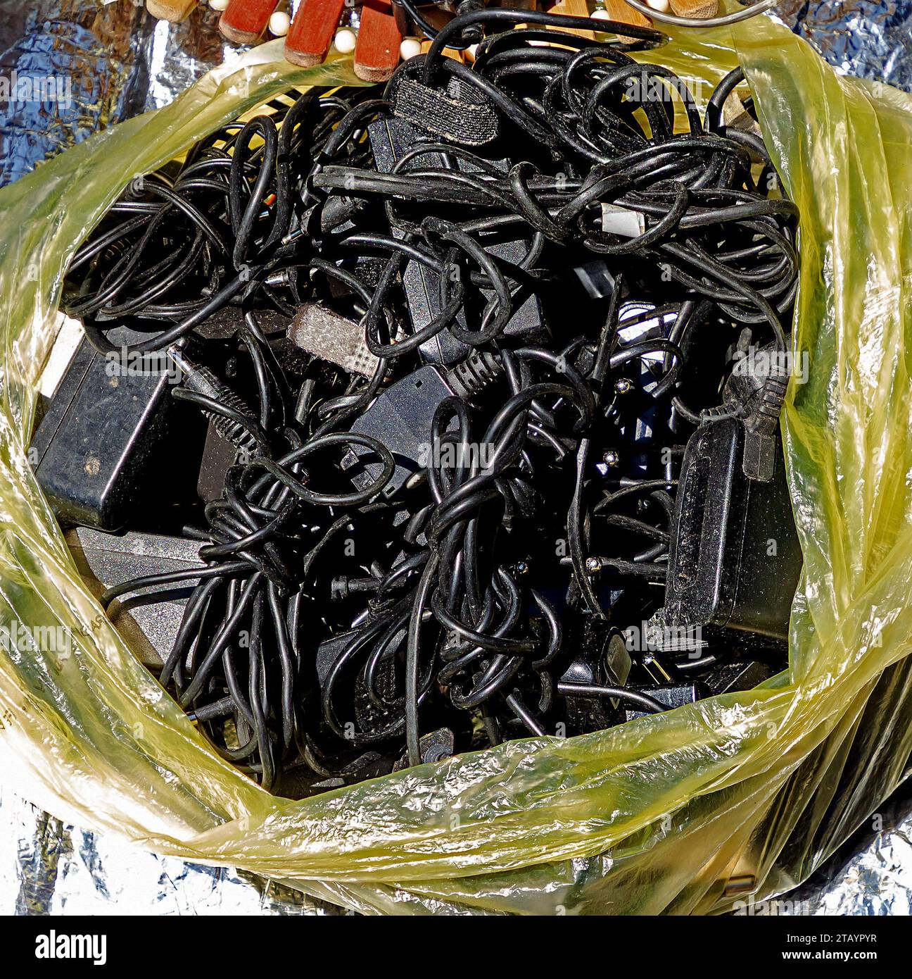 Electric charges with messy cables pile on a market Stock Photo - Alamy
