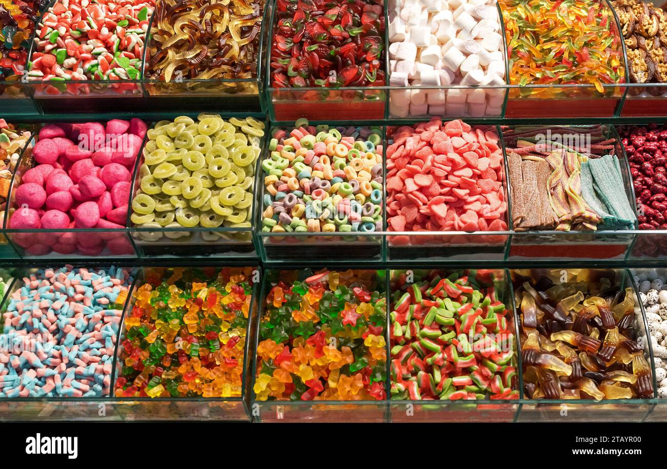 Piles of colorful jelly sweets sold outside on a market stall Stock ...