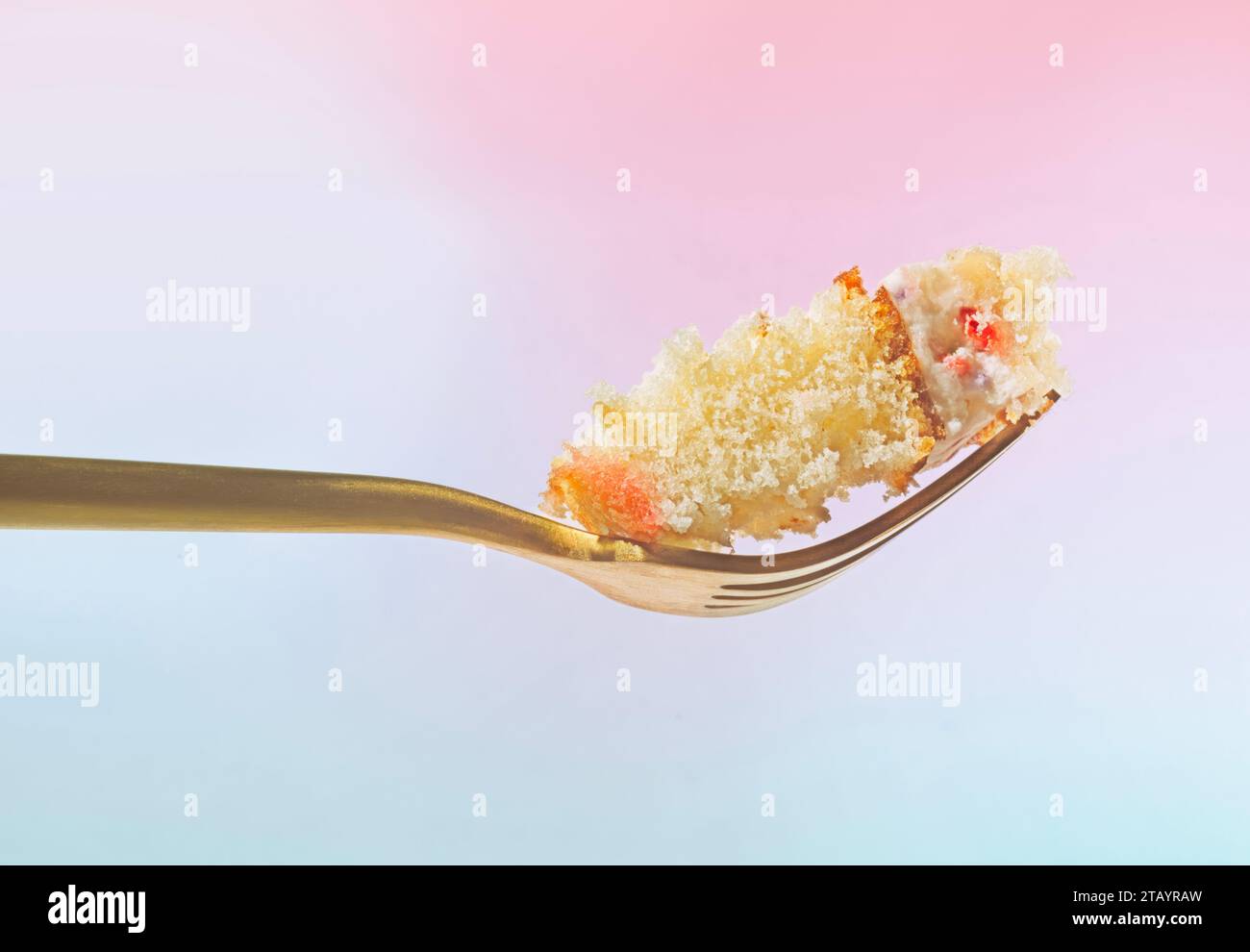 A Delicious Bite of White Cake on a Gold Fork Stock Photo - Alamy