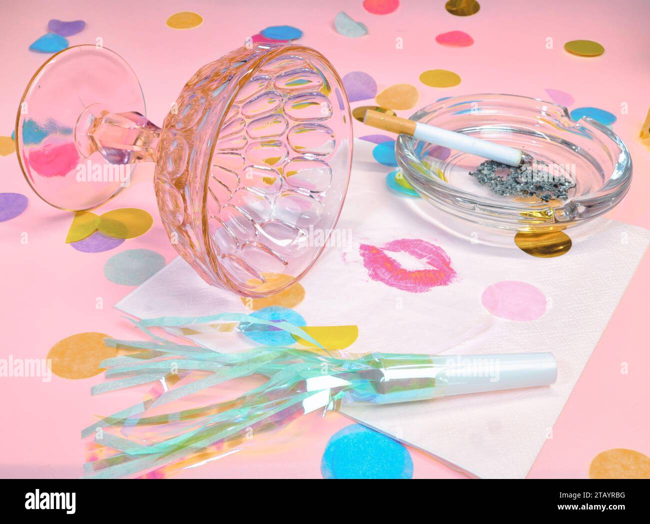 A Tipped of Champagne Glass, Party Horns, A Lipstick Stained Napkin ...