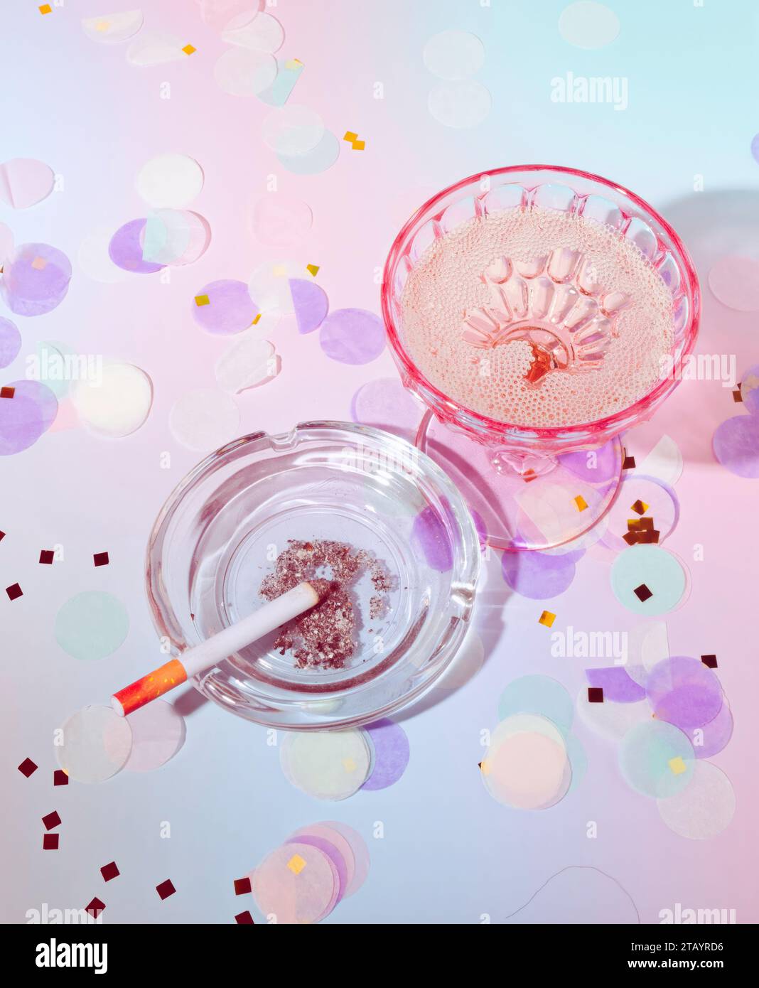 A Cigarette in an Ashtray, Bubbly Champagne in a Glass, Pastel Confetti ...