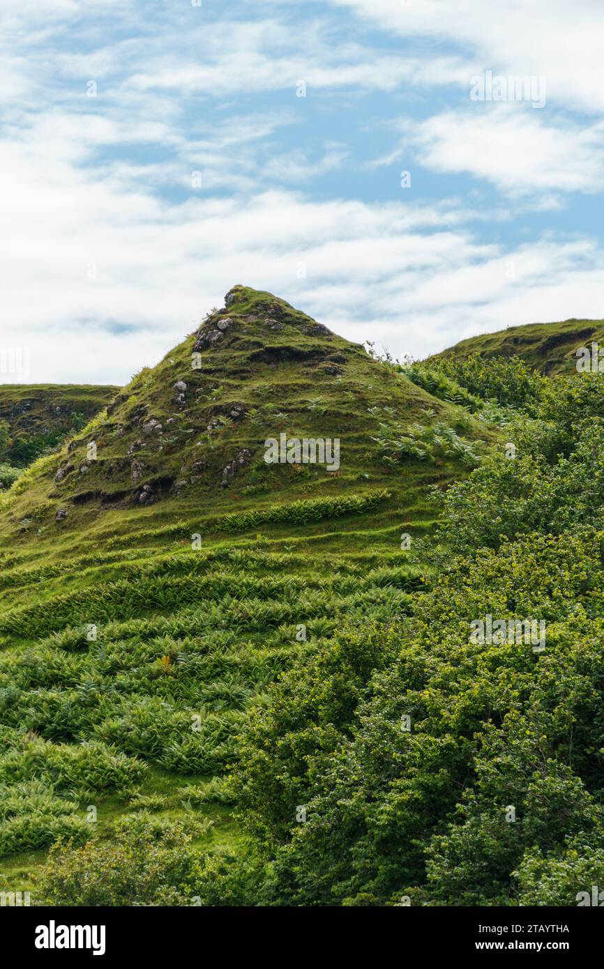 A grassy and rocky fairy mound on the Isle of Skye in Scotland Stock ...