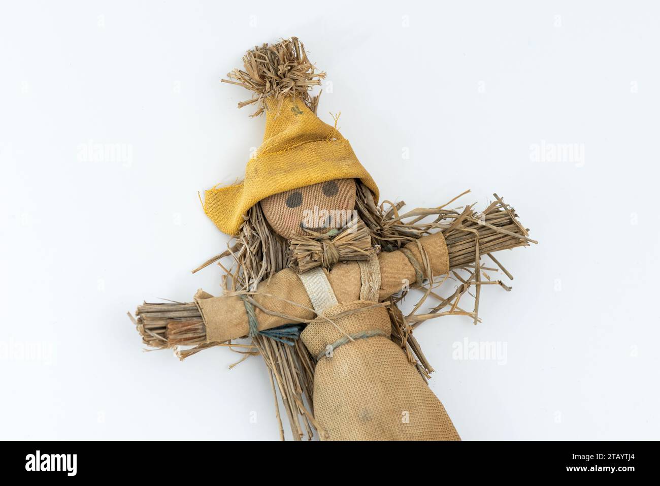 Vintage straw doll.The old way of weaving toys from reeds. An ancient ...