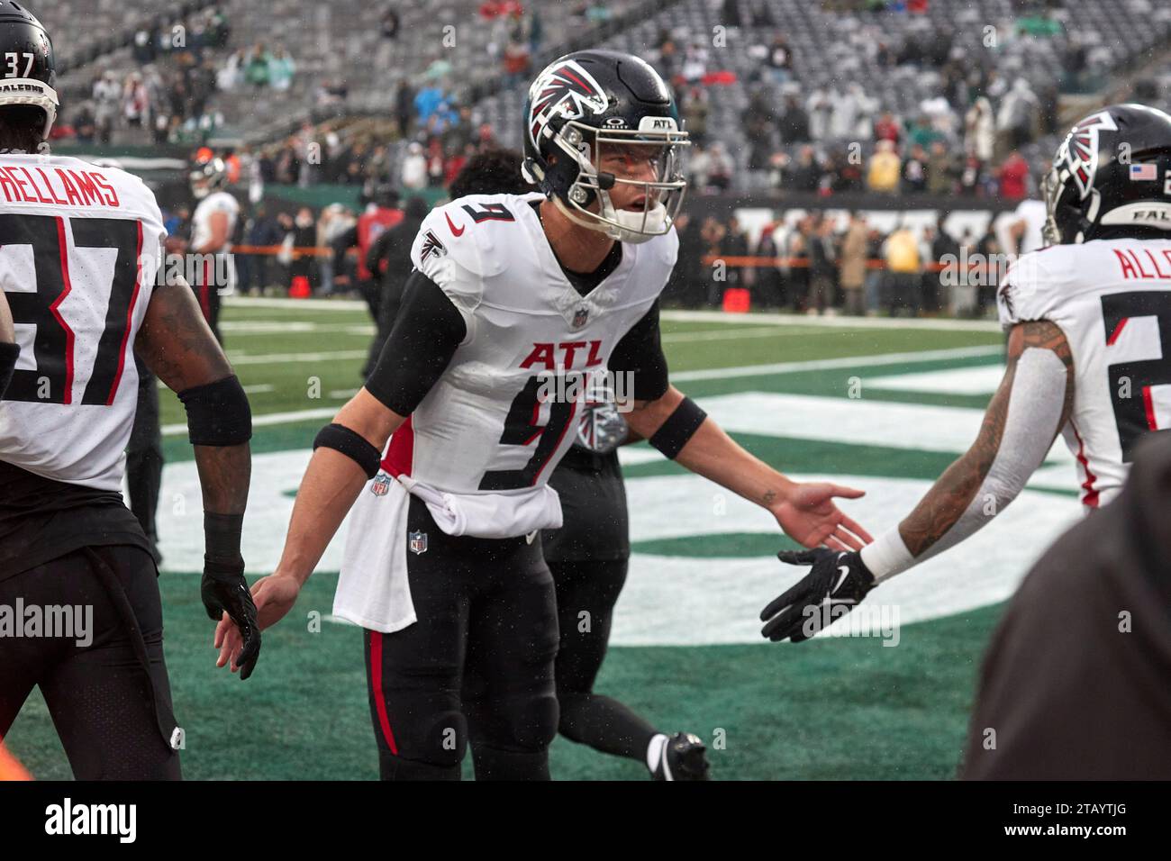 Atlanta Falcons quarterback Desmond Ridder (9) greet teammates for warm ...