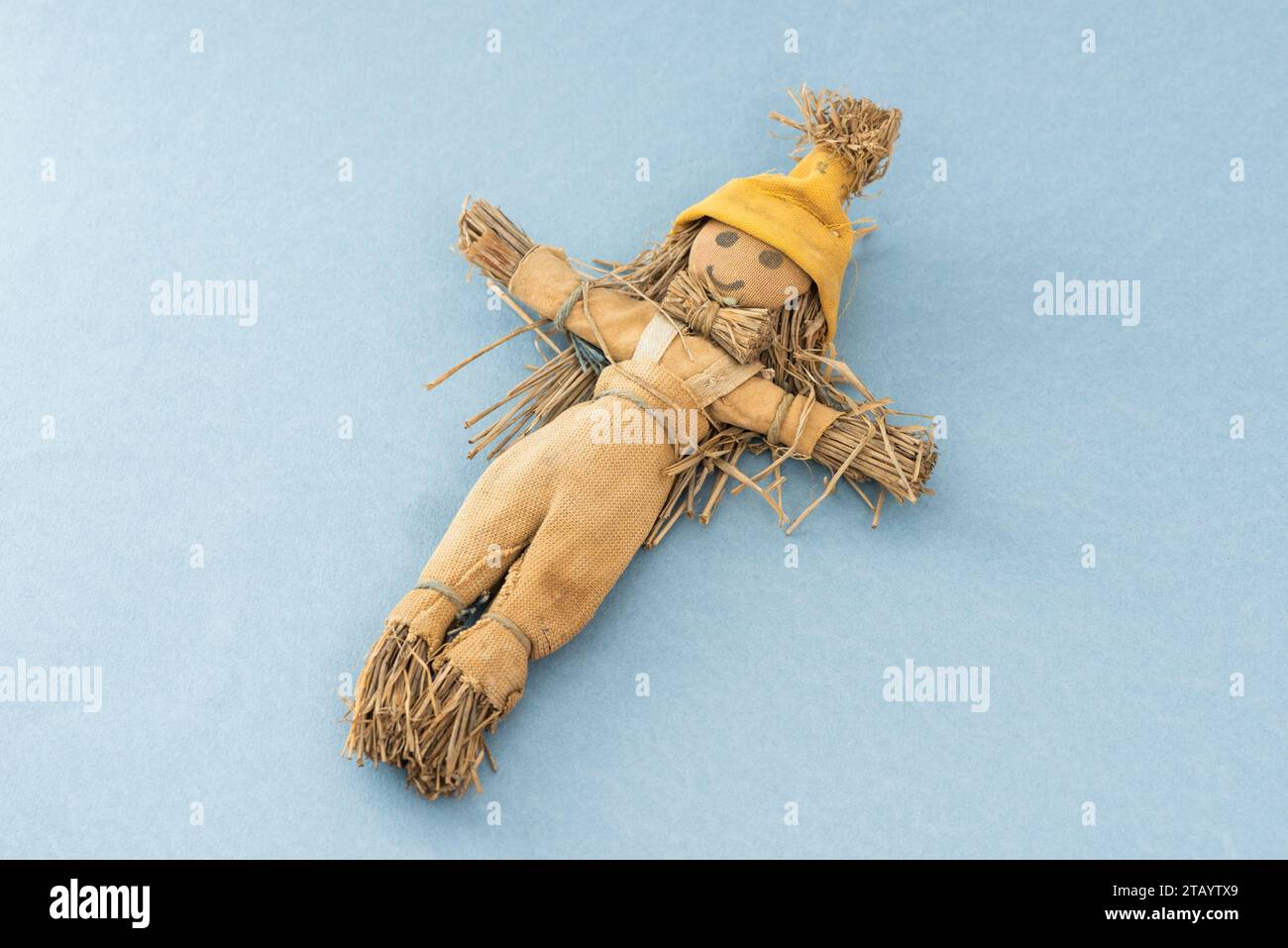 Vintage straw doll.The old way of weaving toys from reeds. An ancient ...