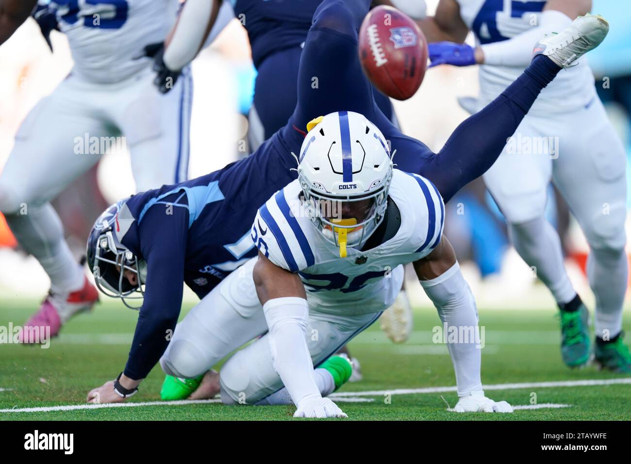 Tennessee Titans punter Ryan Stonehouse, right, flips over Indianapolis ...