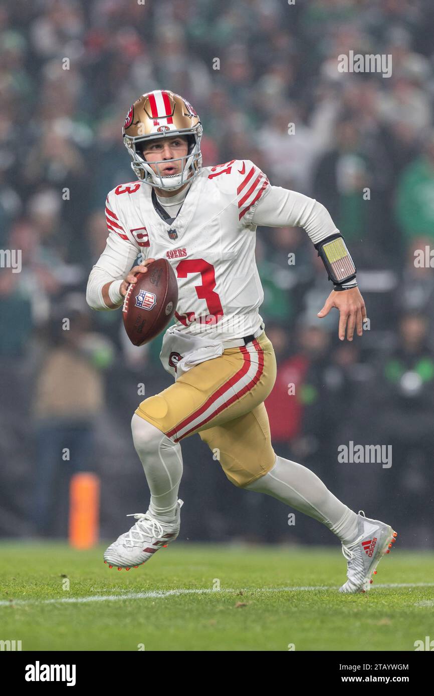 San Francisco 49ers quarterback Brock Purdy (13) rolls out against the ...