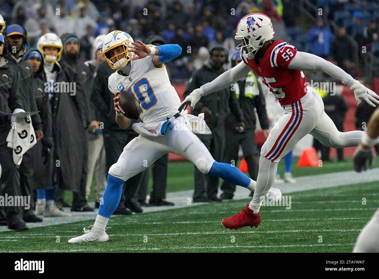 Los Angeles Chargers quarterback Justin Herbert (10) is pushed out of ...