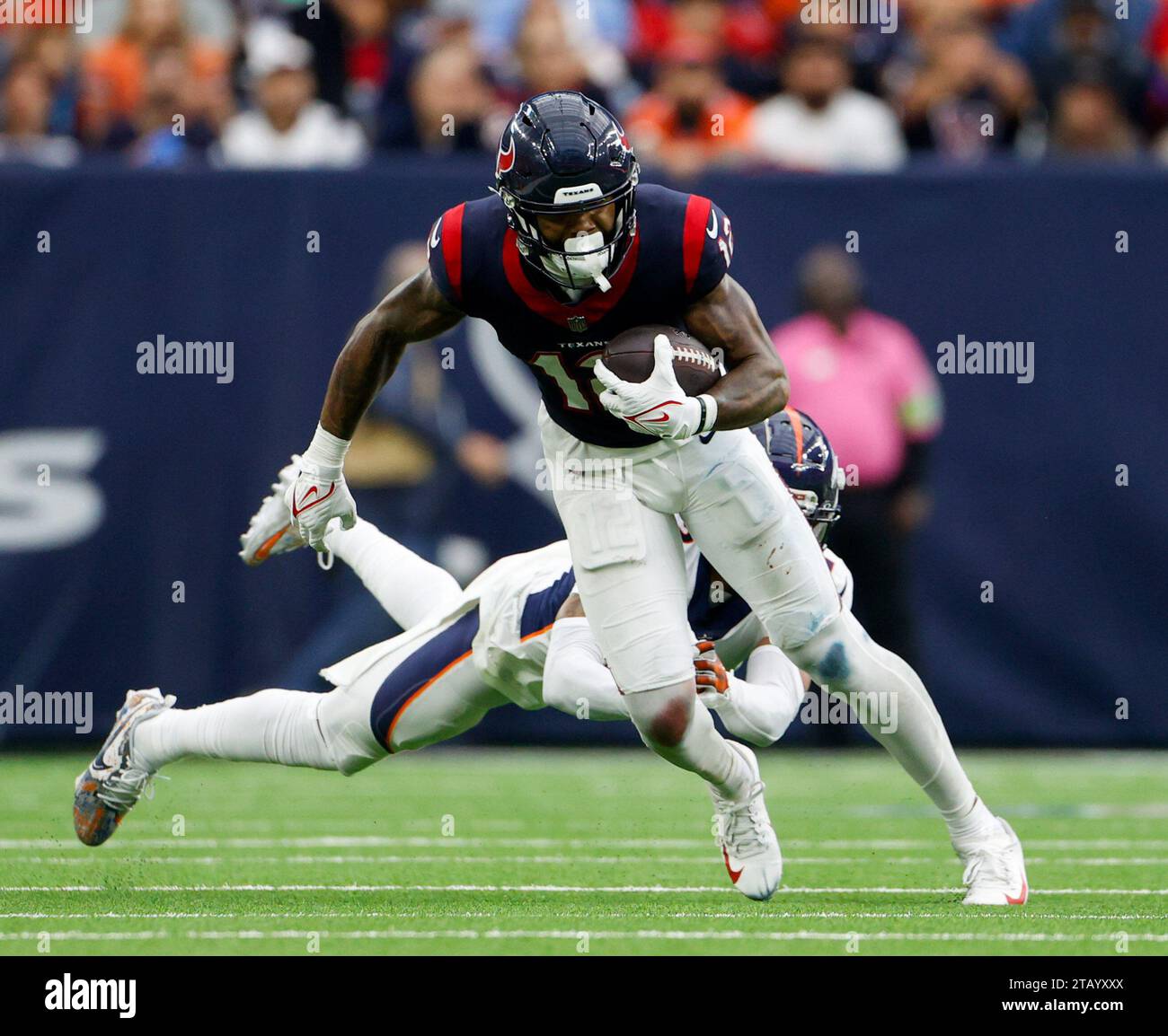 December 3, 2023: Texans wide receiver Nico Collins (12) escapes the ...