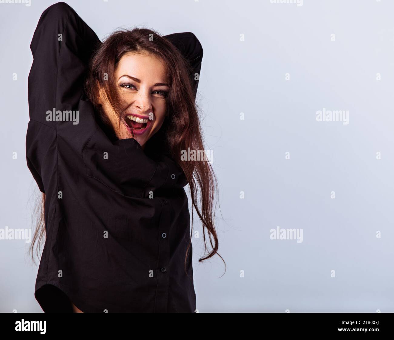 Enjoying happy toothy laughing and positive crying woman posing in ...
