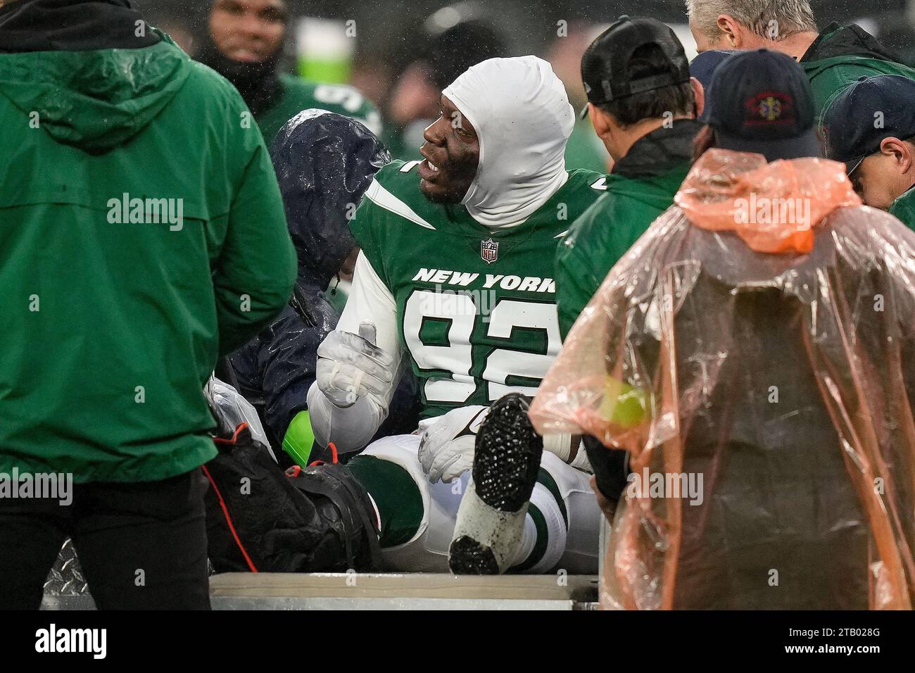 New York Jets defensive tackle Perrion Winfrey (92) is helped off the ...