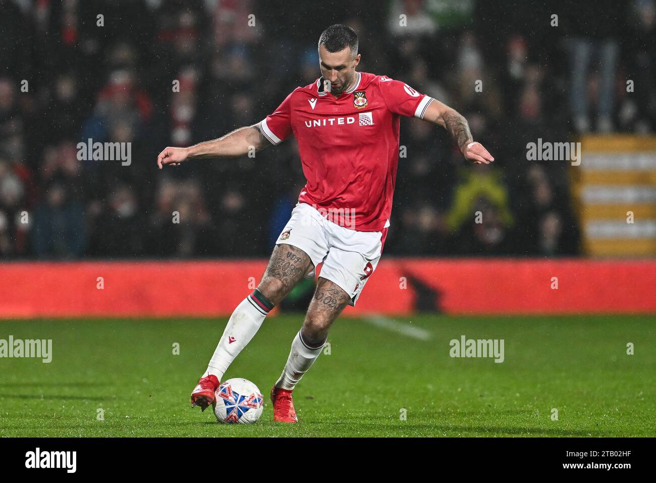 Ollie Palmer #9 of Wrexham makes a break with the ball during the ...