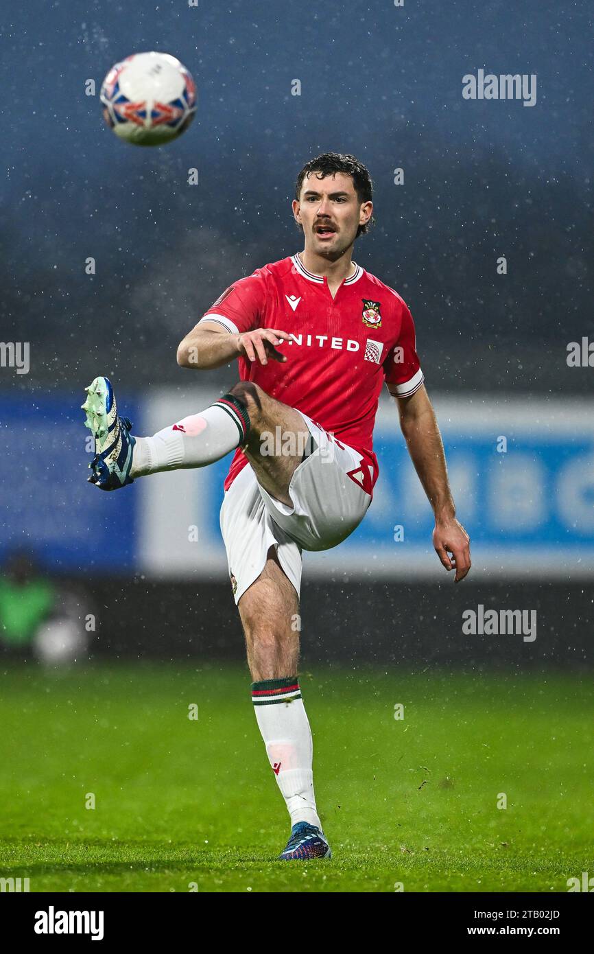 Thomas O'Connor #22 of Wrexham passes the ball during the Emirates FA ...