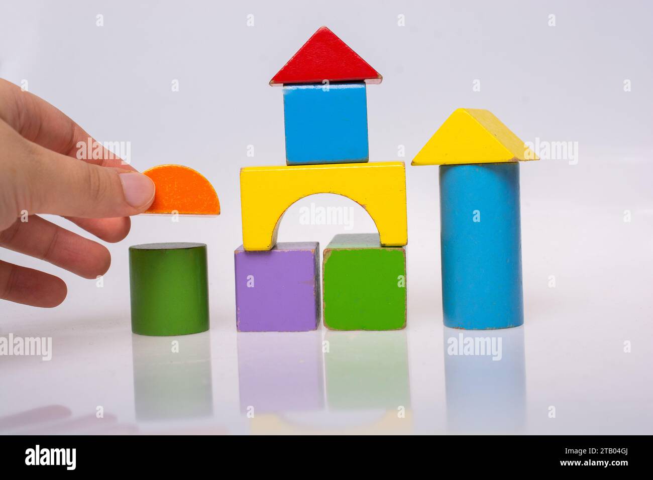 Building tower, castle with Bright colorful wooden blocks toy Stock ...