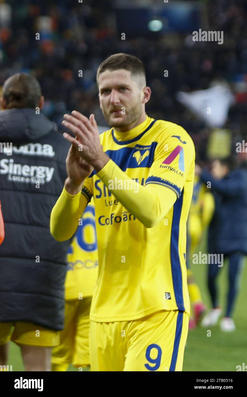 Udine, Italy. 03rd Dec, 2023. Thomas Henry of Hellas Verona FC claps ...