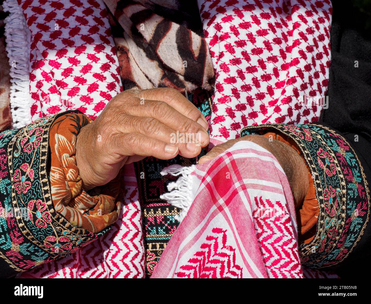 Woman doing needlework at the nymphaeum in the ancient city of Jerash ...