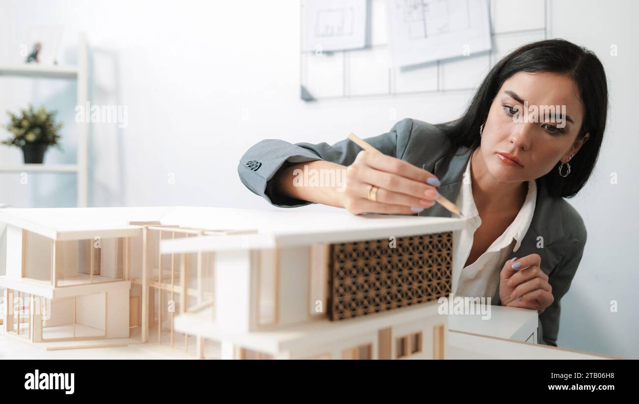 Closeup of professional beautiful young architect engineer focus on ...