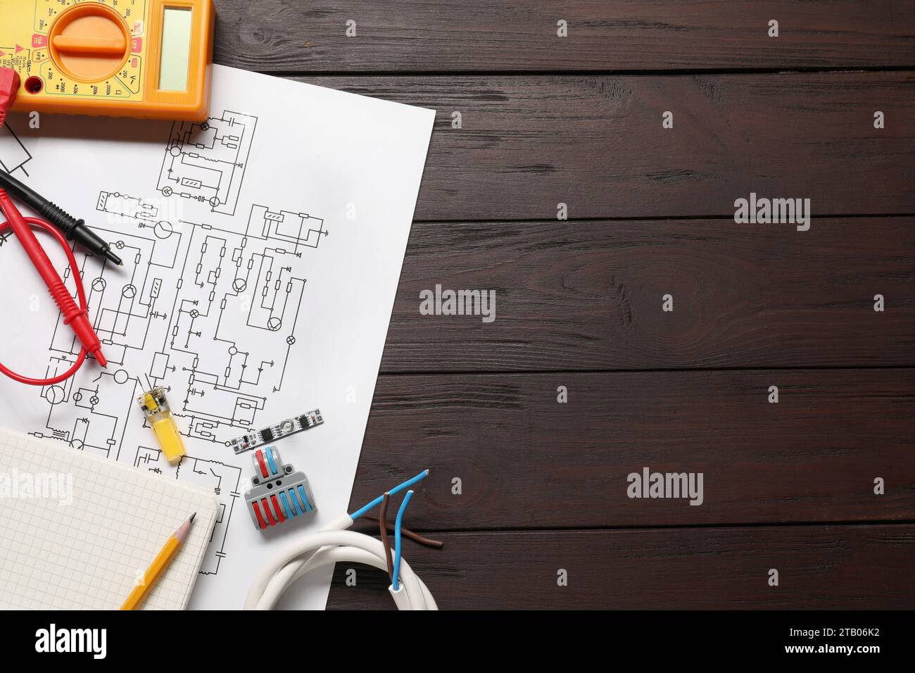 Wiring diagram, office stationery, wires and digital multimeter on ...