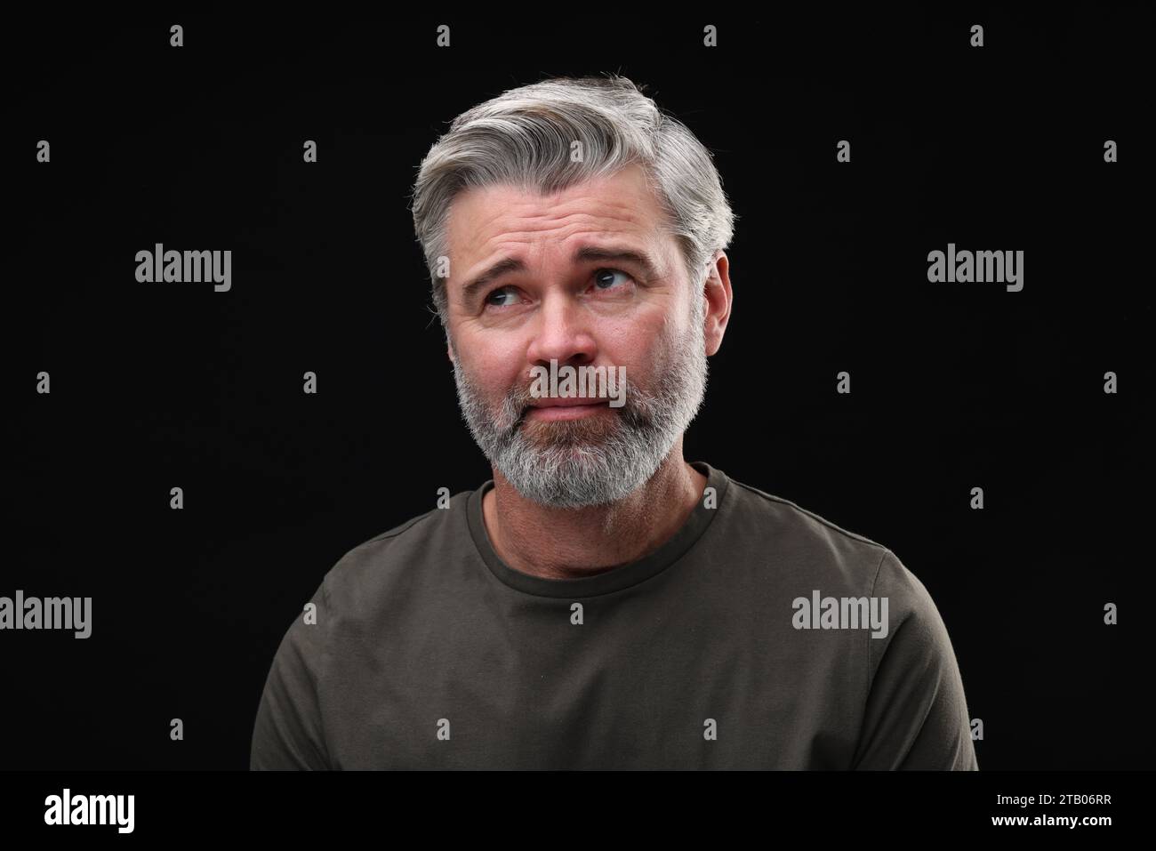 Personality concept. Portrait of emotional man on black background ...