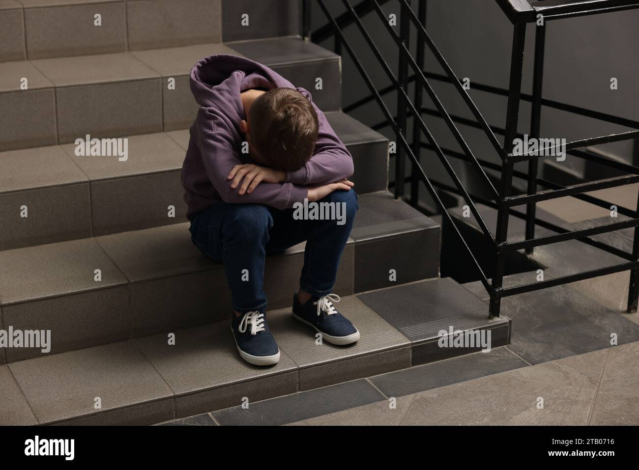 Boy child crying stairs alone hi-res stock photography and images - Alamy
