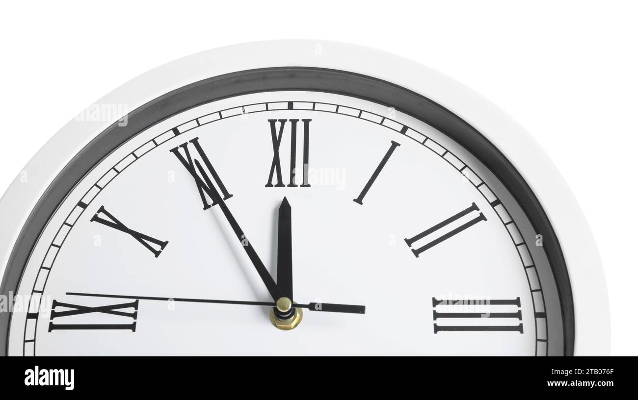 Clock showing five minutes until midnight on white background, closeup ...