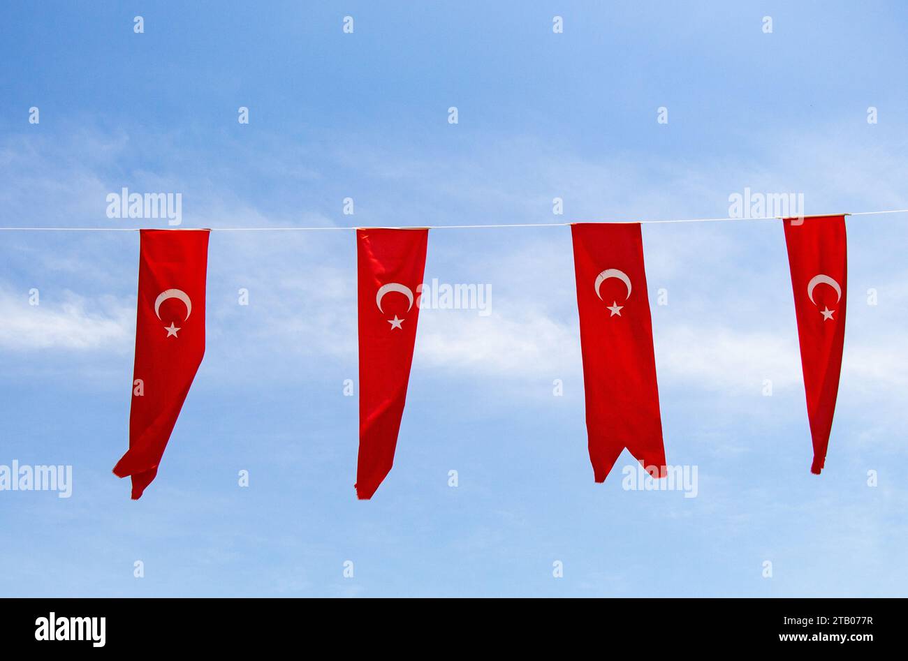 Turkish national flags with white star and moon in sky Stock Photo - Alamy
