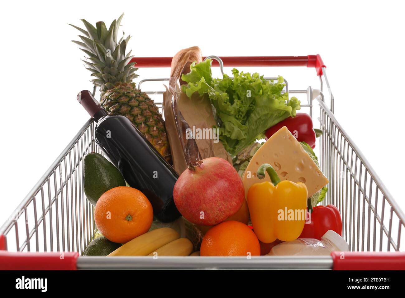Shopping cart with groceries on white background, closeup Stock Photo ...