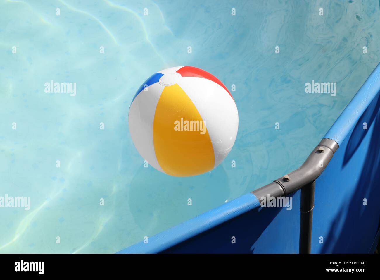 Inflatable ball on water in above ground swimming pool outdoors Stock ...