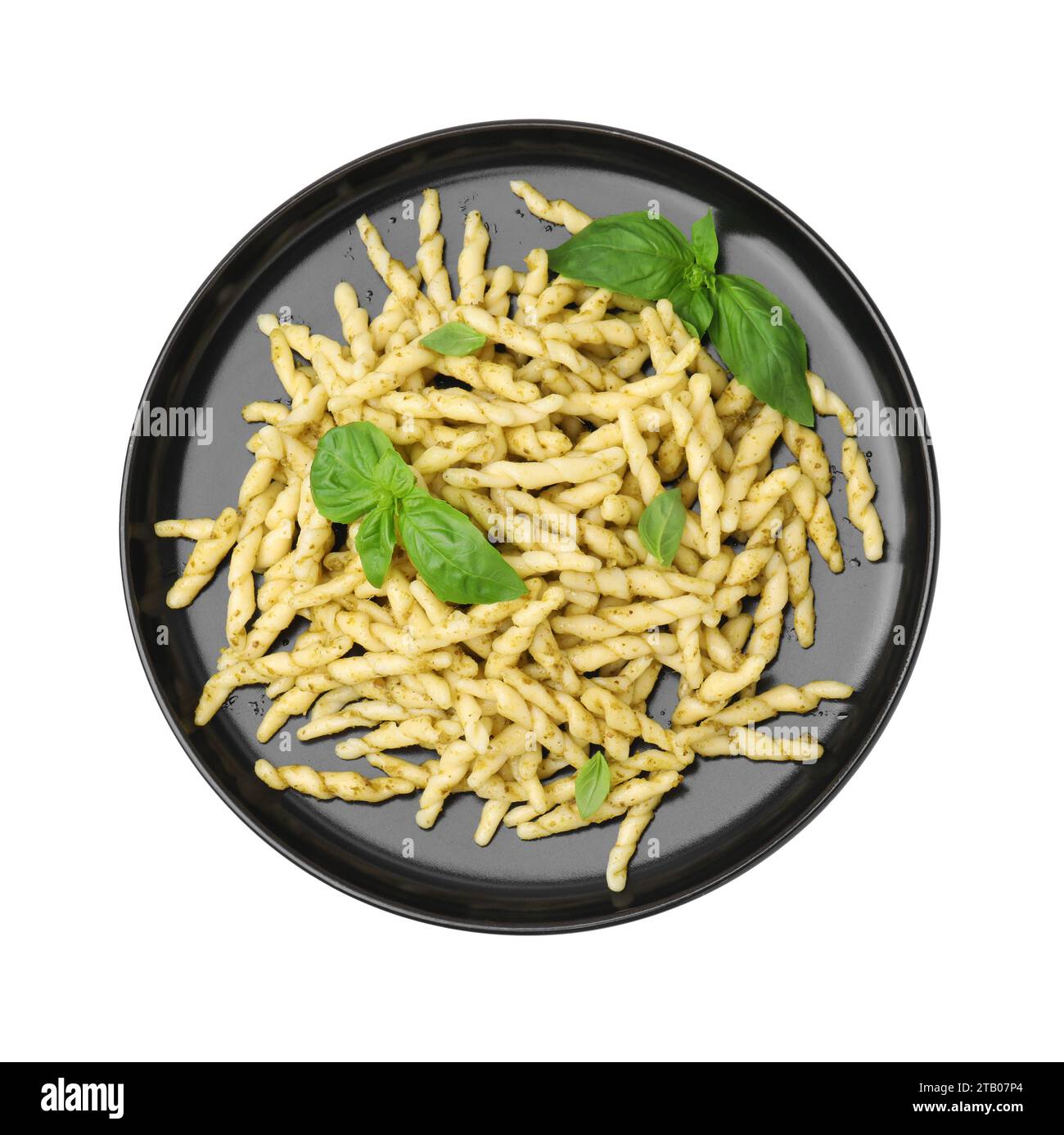 Plate of delicious trofie pasta with pesto sauce and basil leaves ...