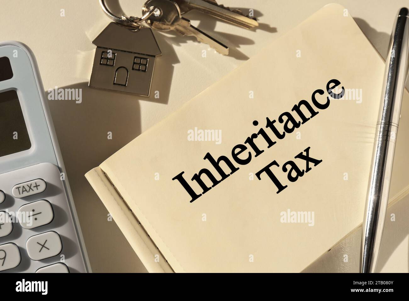Notepad with phrase Inheritance Tax, calculator and keys with house ...