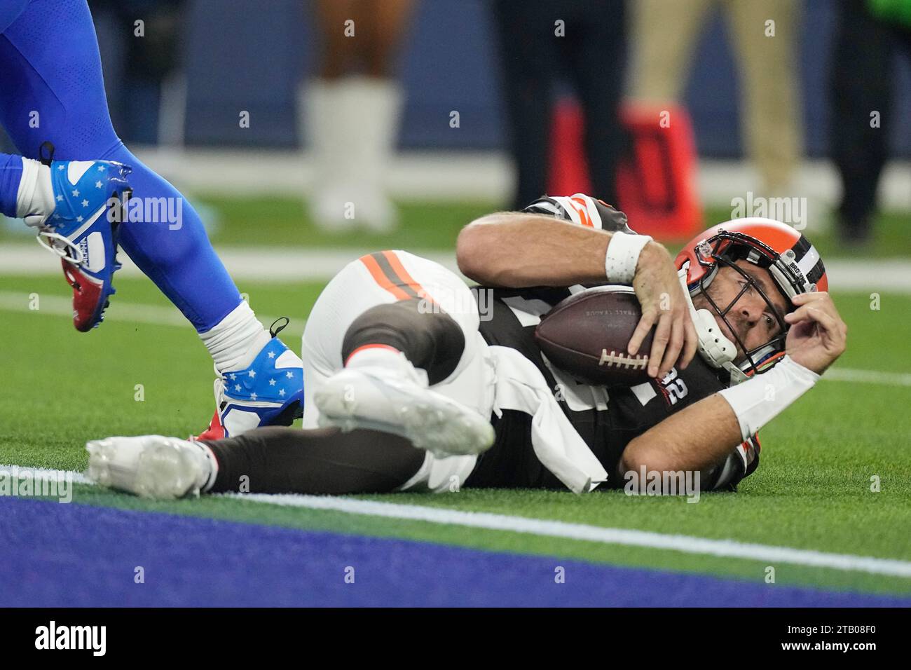 Cleveland Browns quarterback Joe Flacco falls down after being tackled ...